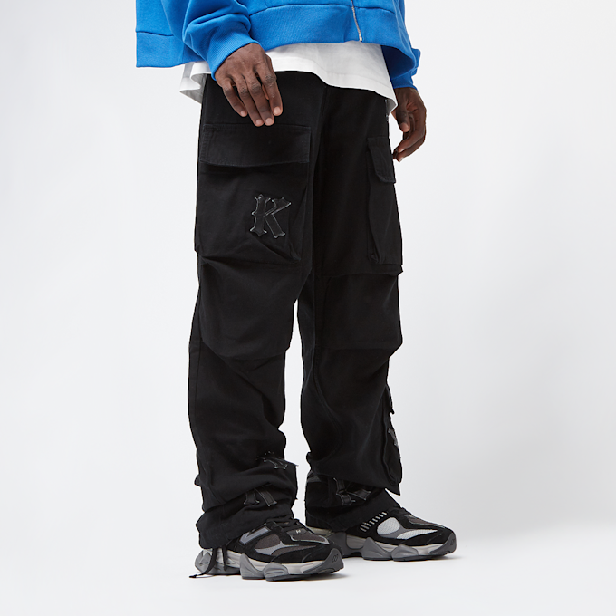 Shop Karl Kani K Patch Multipocket Cargo Pants black zwart | SNIPES