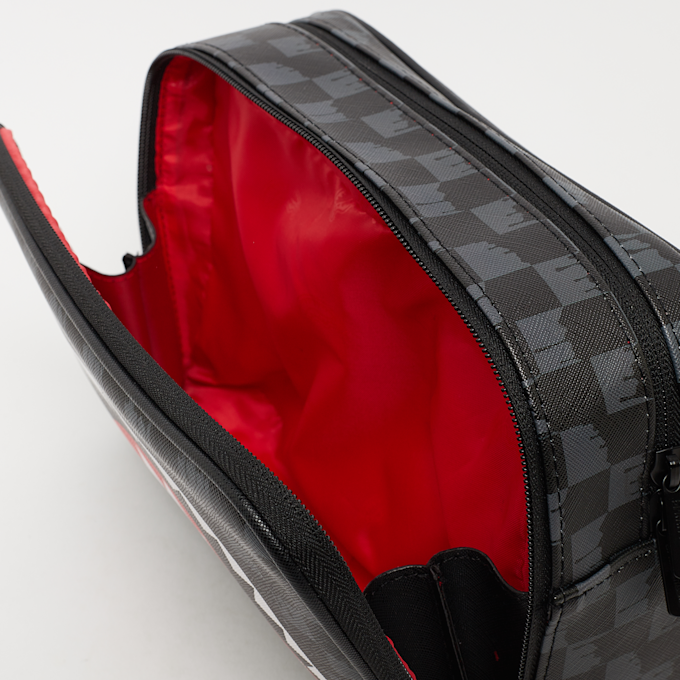 Compra SPRAYGROUND Drip Check Shark Toiletry Brick grey gris | SNIPES